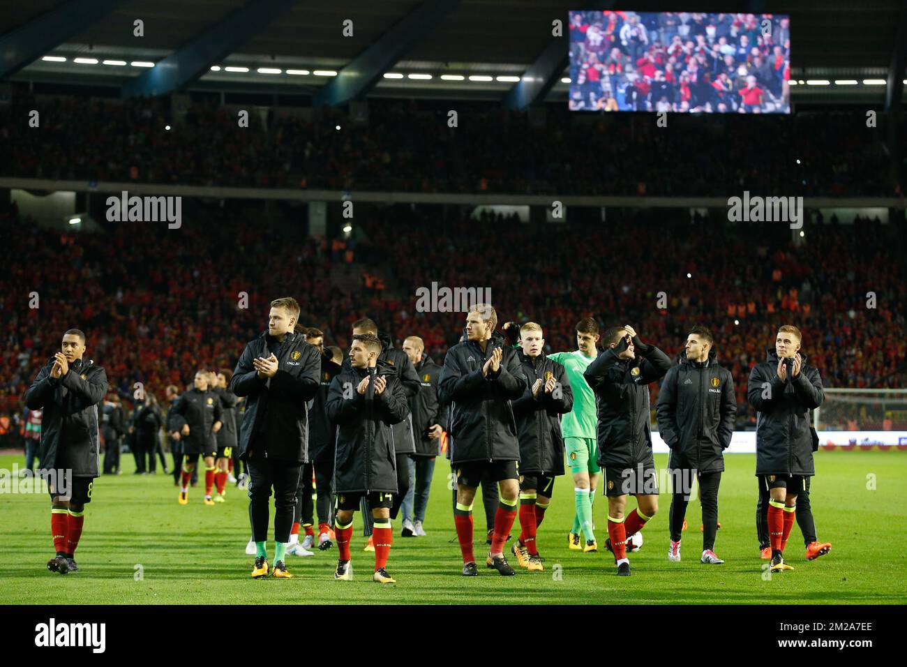 Belgium's players celebrate after winning with Belgium's Youri ...