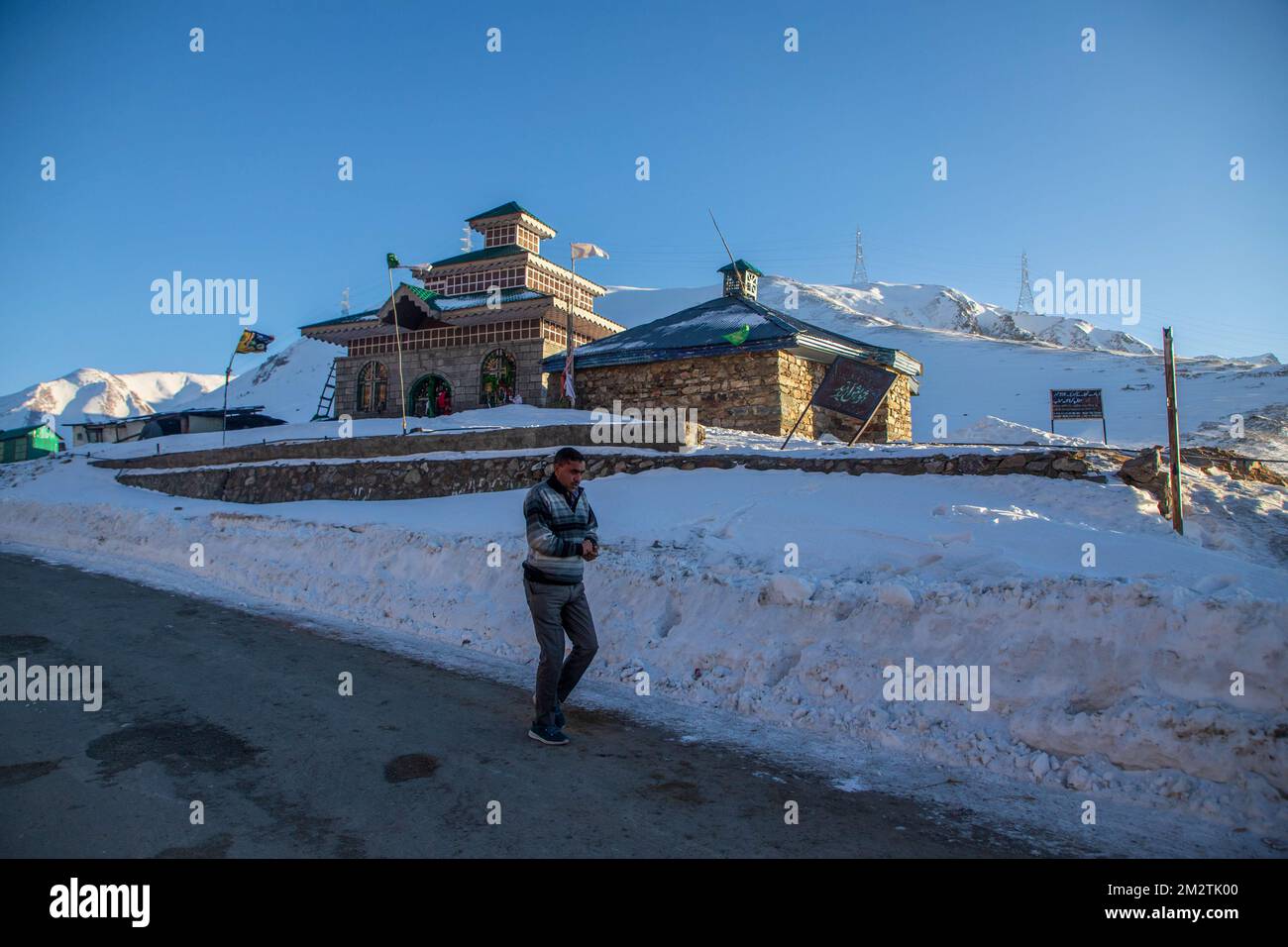A Kashmiri man walks along Mughal road near Peer Ki Gali on a cold ...