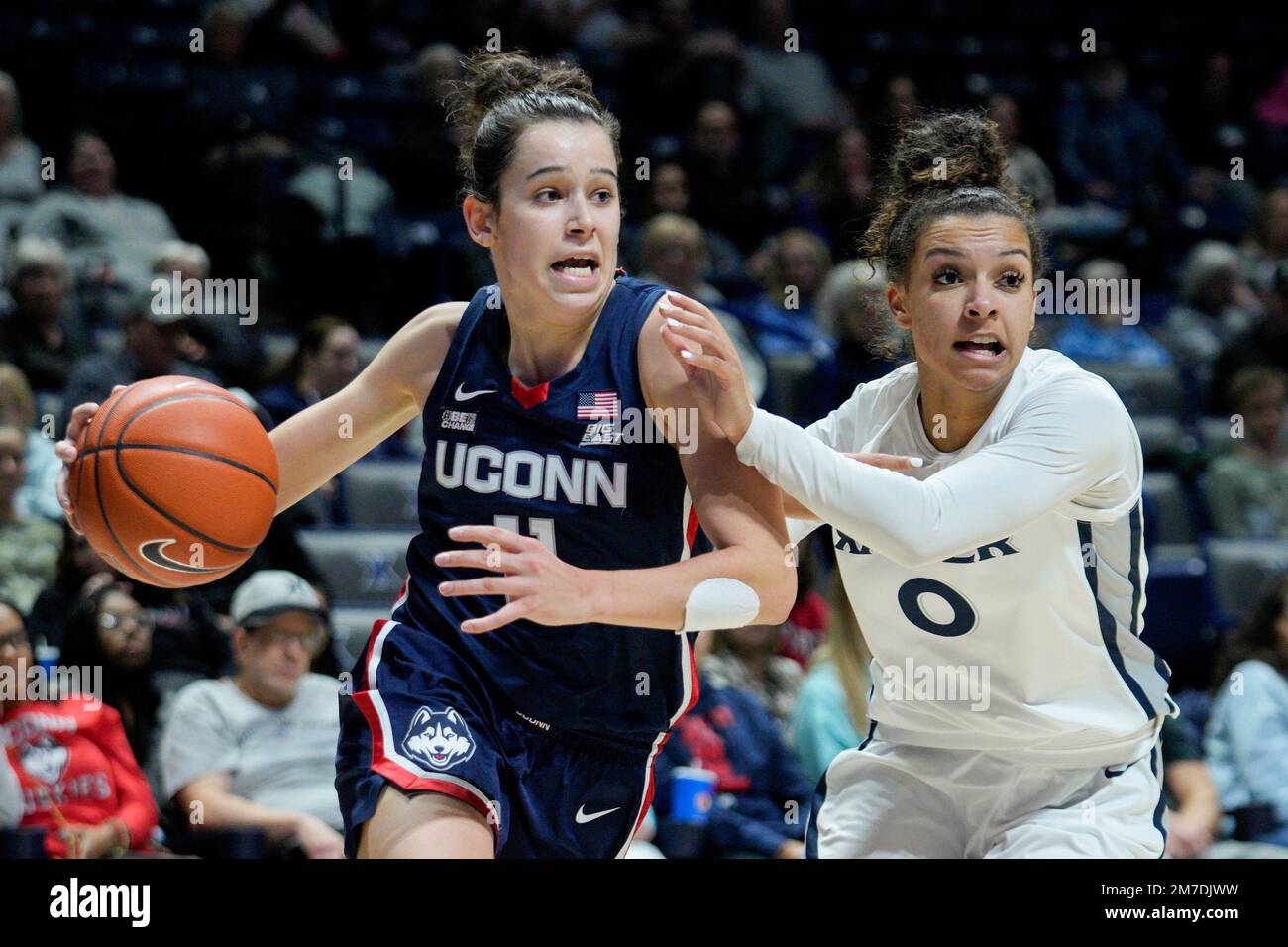 UConn forward Lou Lopez Senechal (11) drives against Xavier's Shelby ...