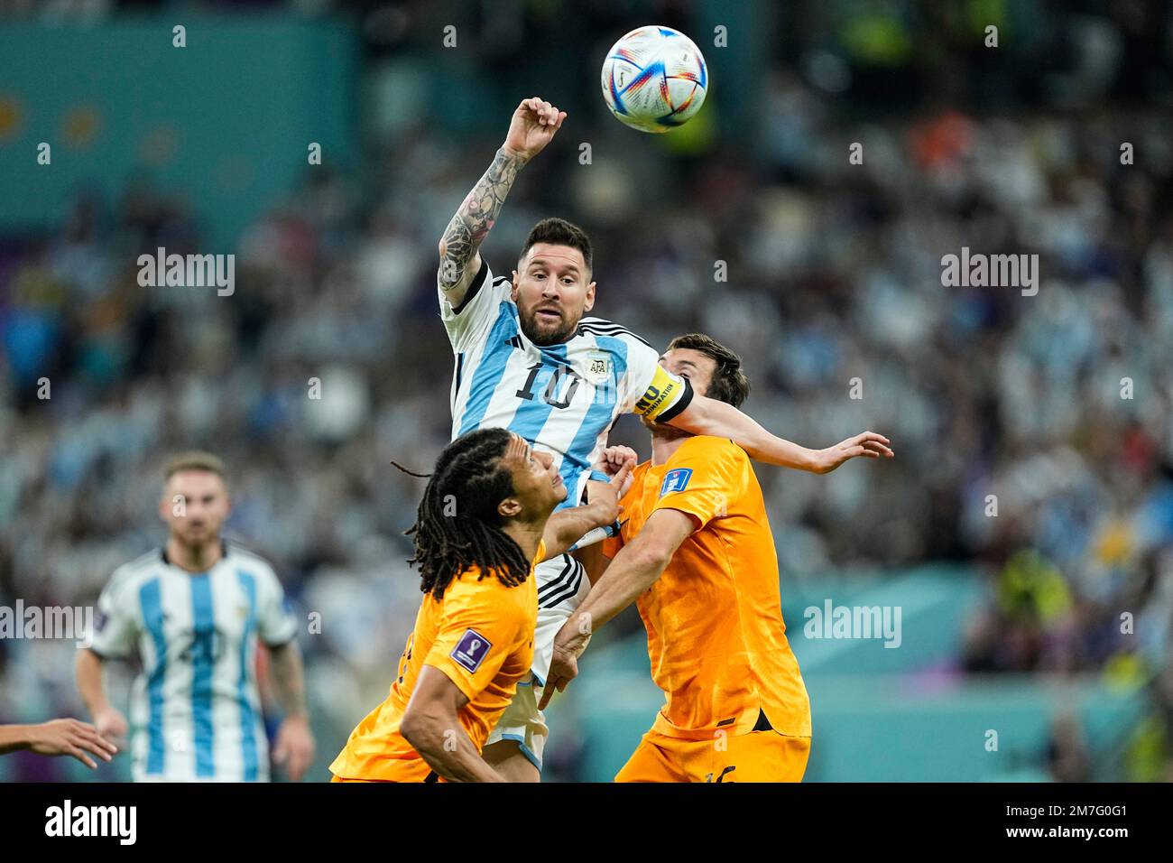 Argentina's Lionel Messi jumps for the ball as Nathan Ake of the ...
