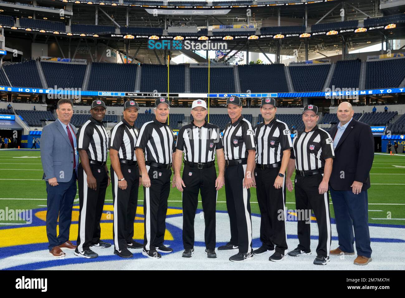 Officials pose before an NFL football game between the Los Angeles Rams ...