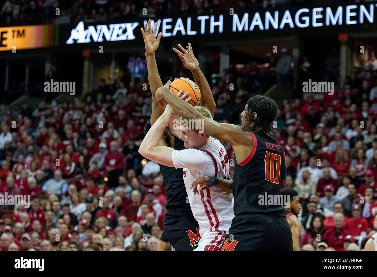 Wisconsin's Steven Crowl (22) against Maryland's Donta Scott, behind ...