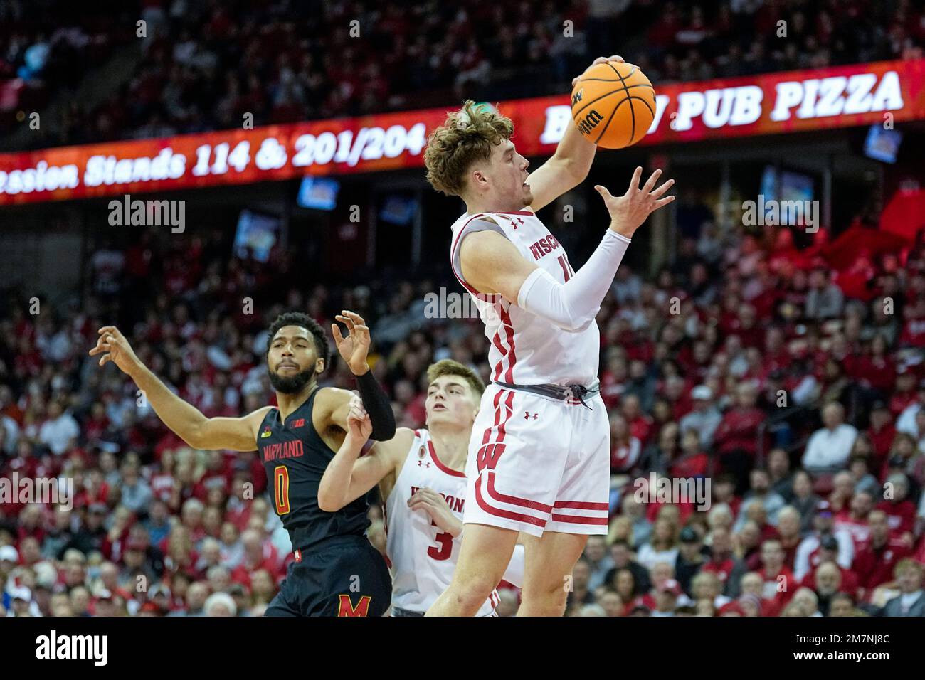 Wisconsin's Max Klesmit (11), Maryland's Don Carey (0) and Wisconsin's ...