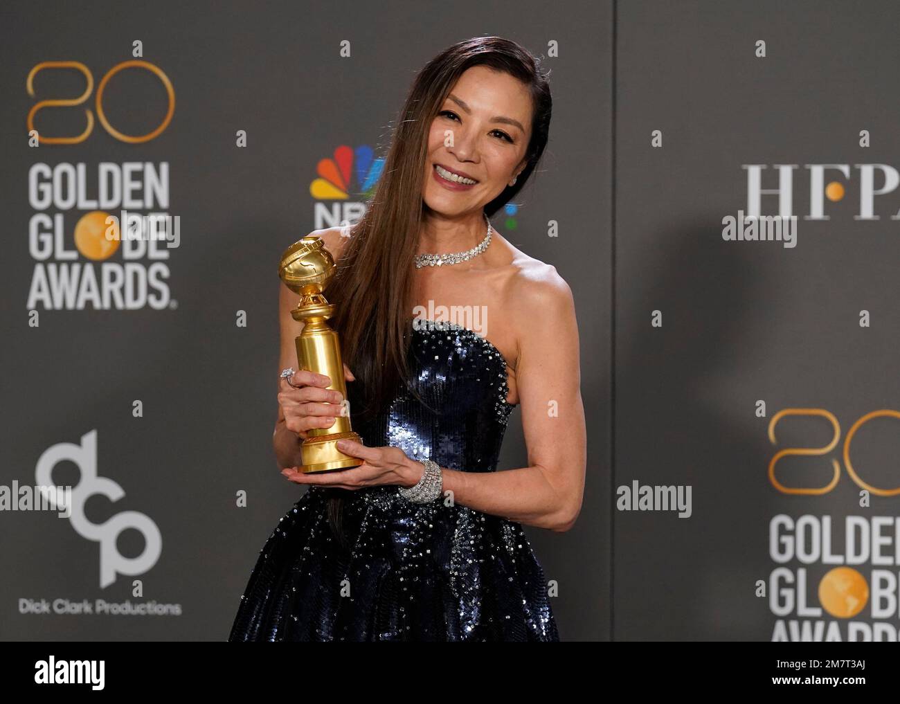 Michelle Yeoh poses in the press room with the award for best performance by an actress in a ...
