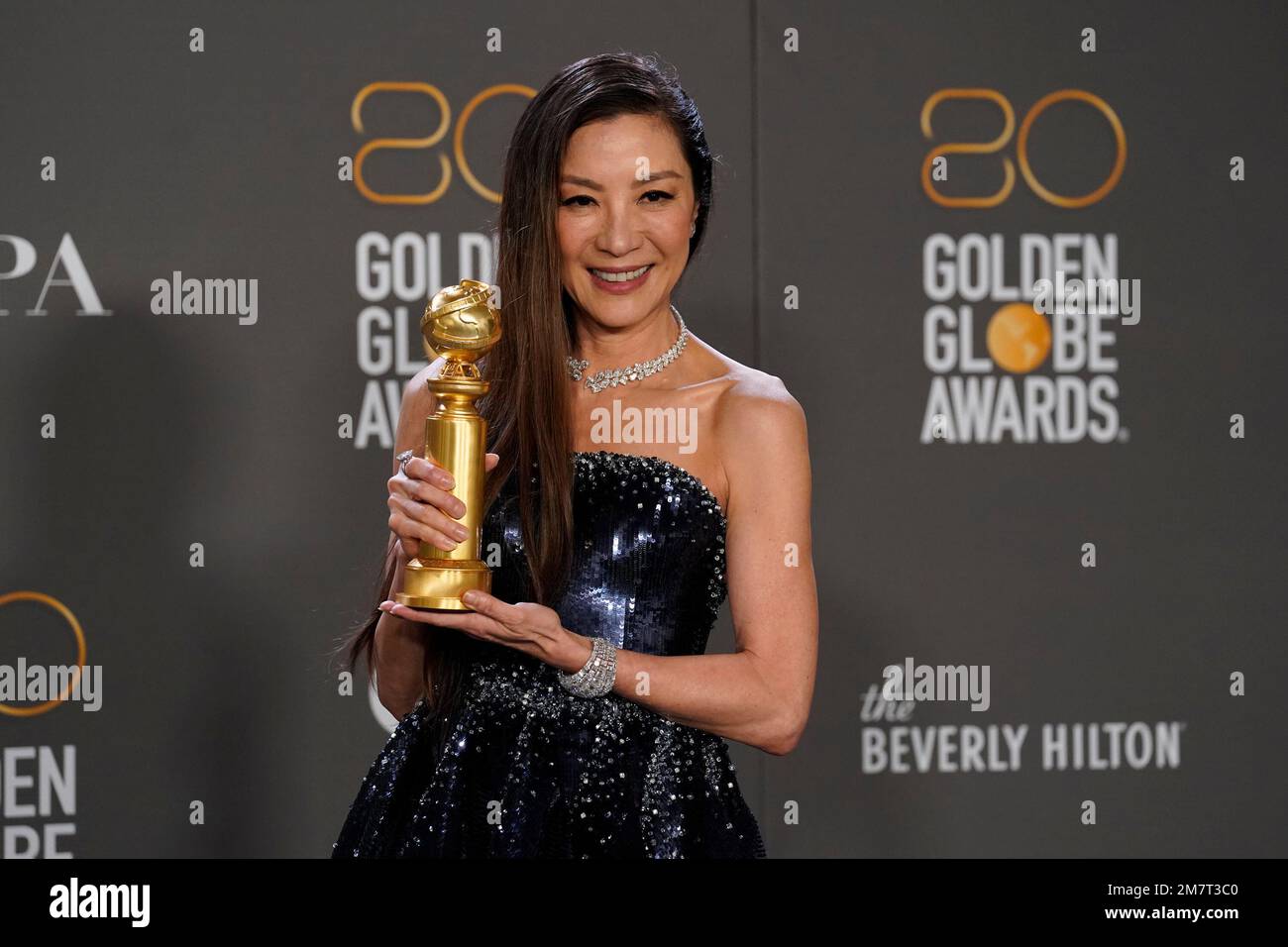 Michelle Yeoh poses in the press room with the award for best performance by an actress in a ...