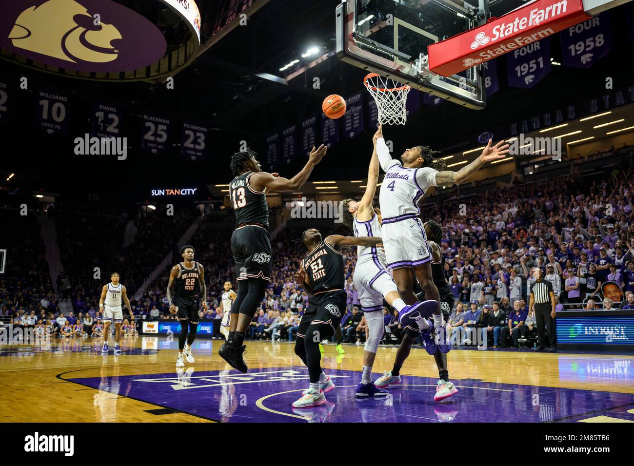 Kansas State guard Tykei Greene (4) and Oklahoma State guard Quion ...