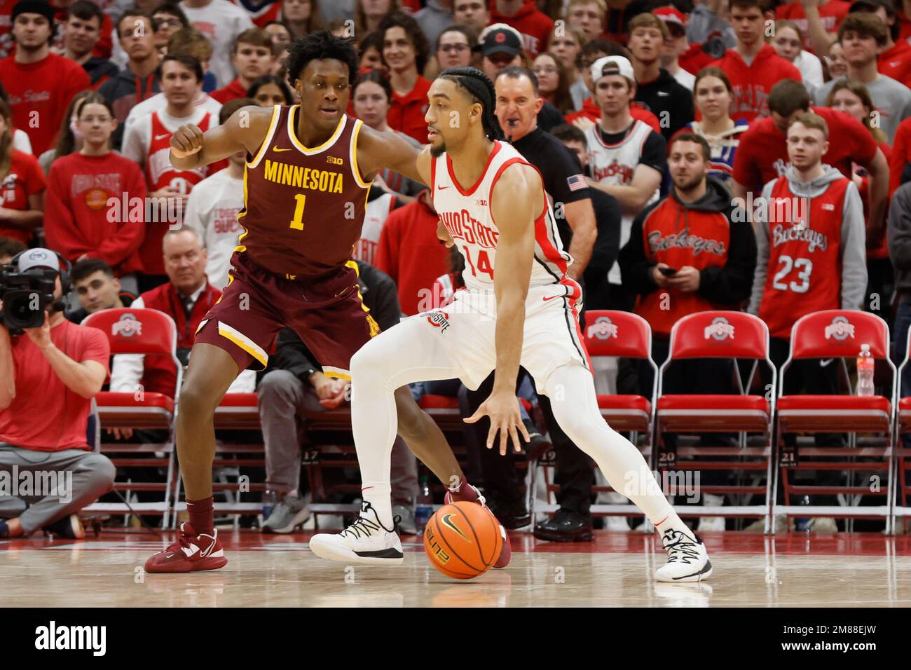 Ohio State's Justice Sueing, right, is defended by Minnesota's Joshua ...