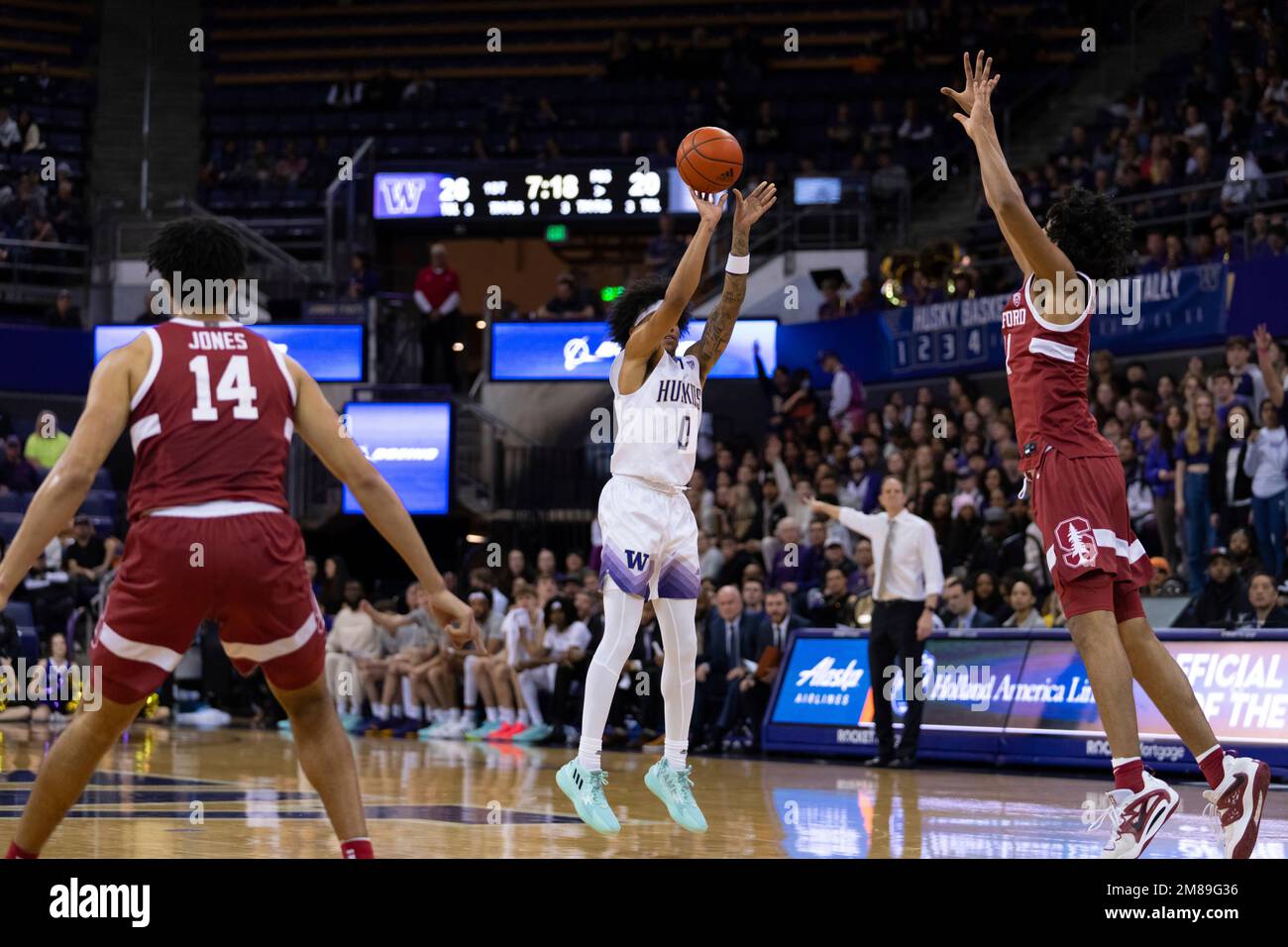 Washington guard Koren Johnson shoots in front of Stanford guard Ryan ...