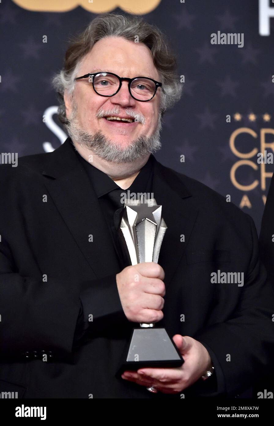 Guillermo del Toro" poses with the award for best animated feature for "Guillermo del Toro's ...