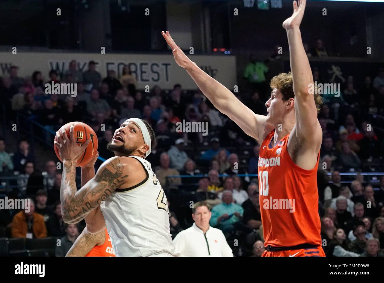 Wake Forest forward Davion Bradford, left, drives against Clemson ...