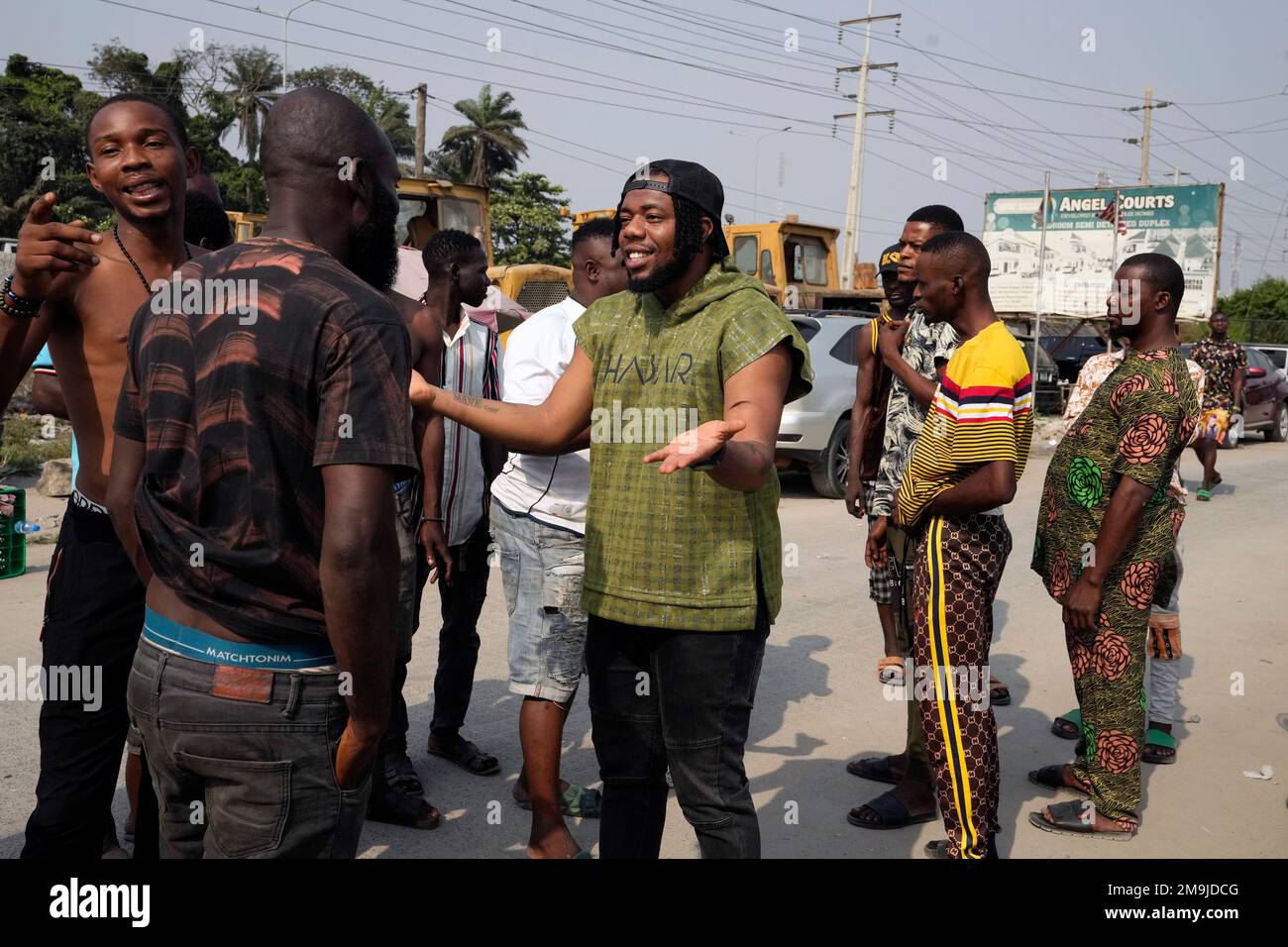 Nigeria's Rapper Dandizzy, centre, freestyles a song on the Street ...