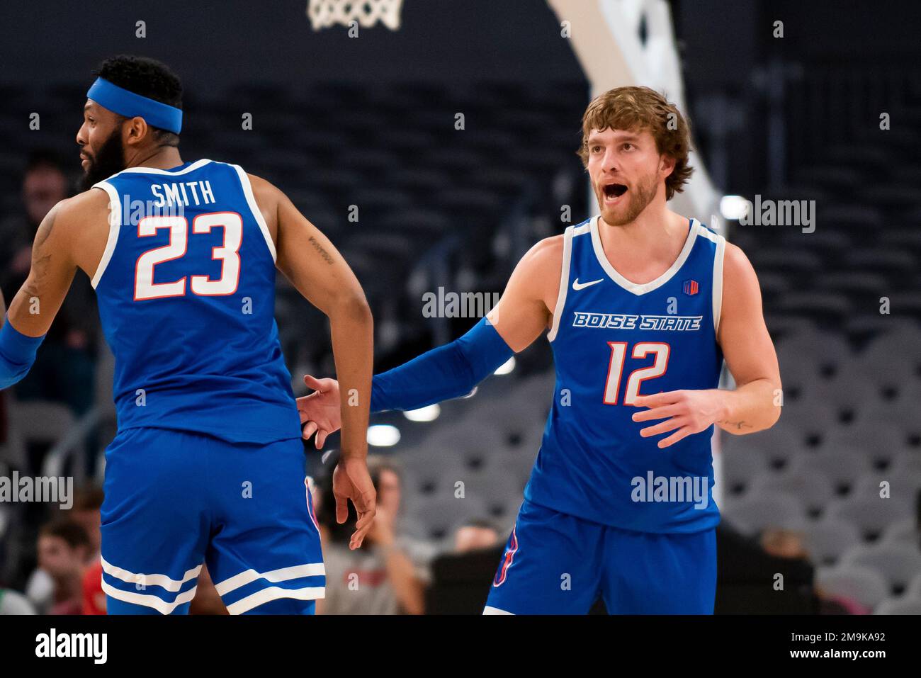 Boise State guard Max Rice (12) greets forward Naje Smith (23) after ...