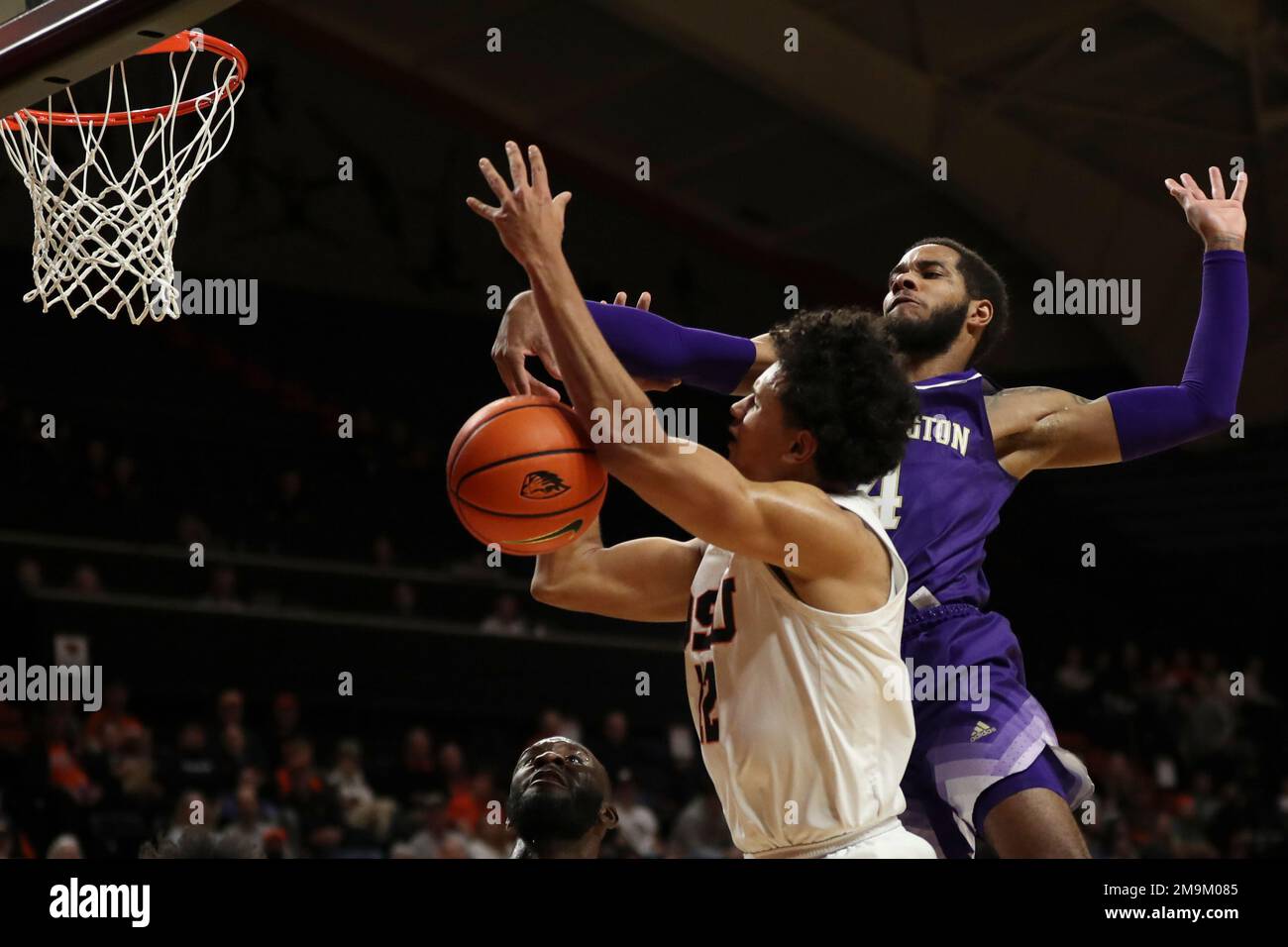 Oregon State forward Michael Rataj (12) is fouled by Washington guard ...