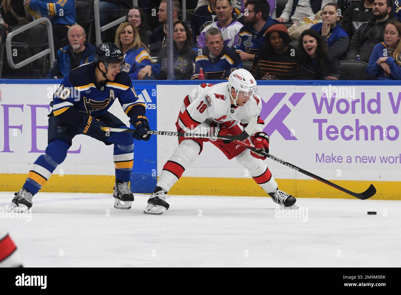 Carolina Hurricanes' Jack Drury (18) is defended by St. Louis Blues ...