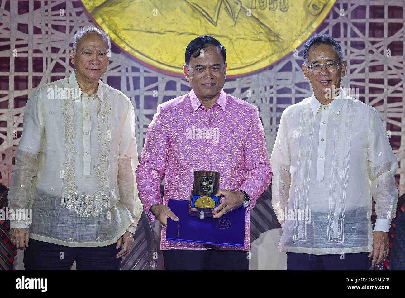 Sotheara Chhim from Cambodia poses with his award with Aurelio Montinola, right, and Ramon ...