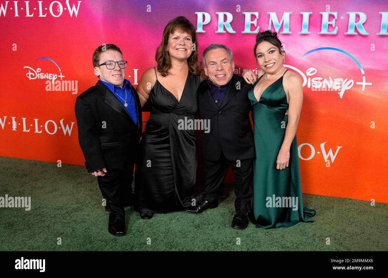 Warwick Davis, second from right, a cast member in "Willow," poses with ...