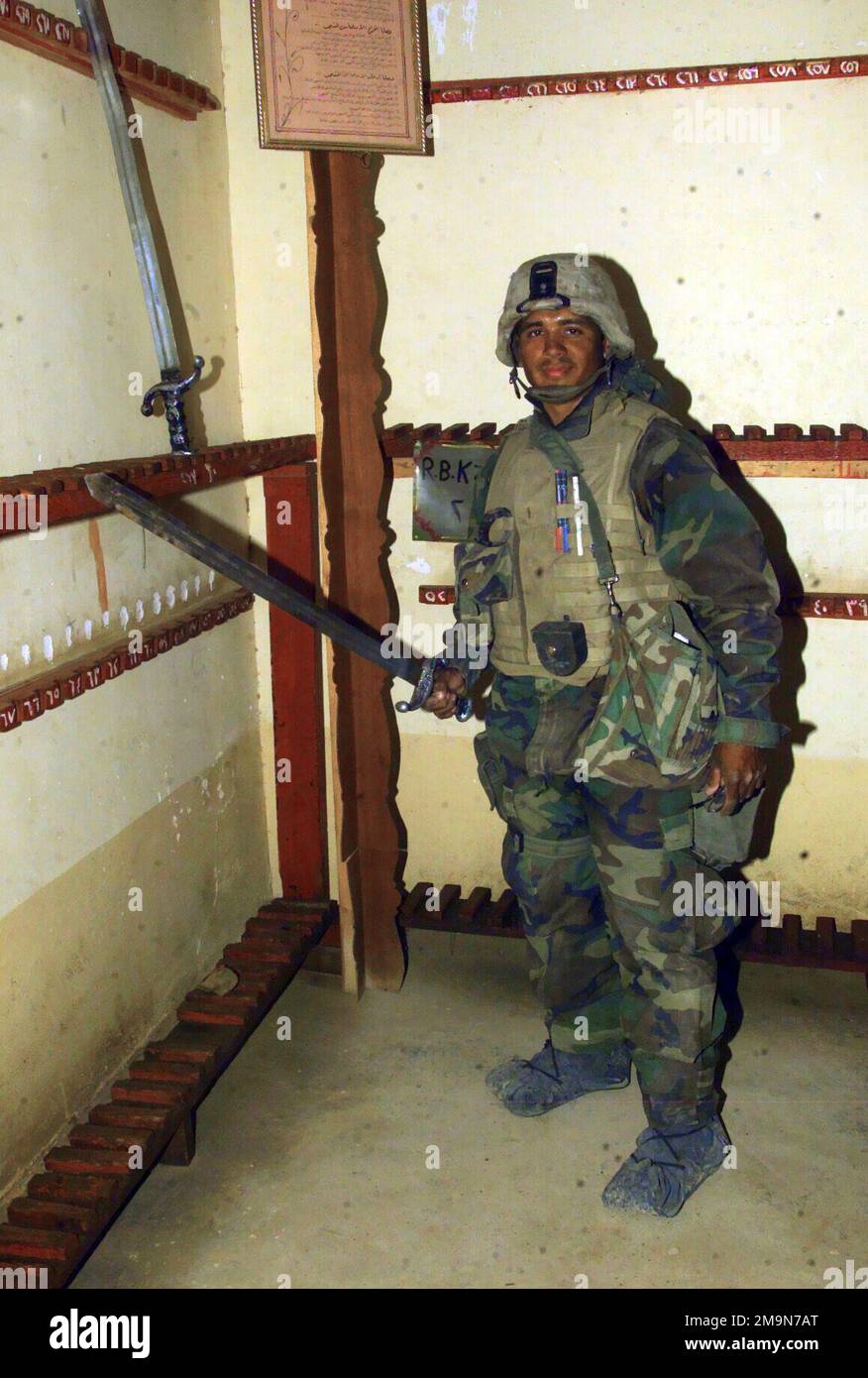 A US Marines Corps (USMC) Marine, Mission-Oriented Protective Posure ...