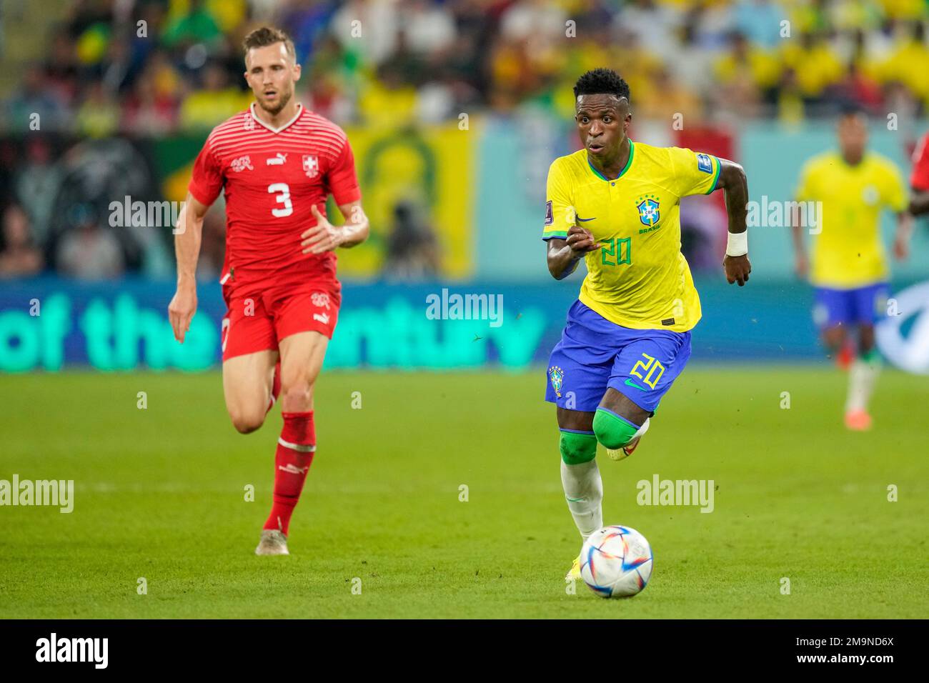 Brazil's Vinicius Junior, right, fights for the ball with Switzerland's ...