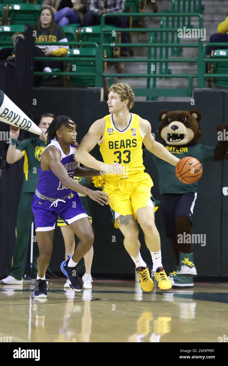 Baylor forward Caleb Lohner (33) drives McNeese State guard Zach Scott ...