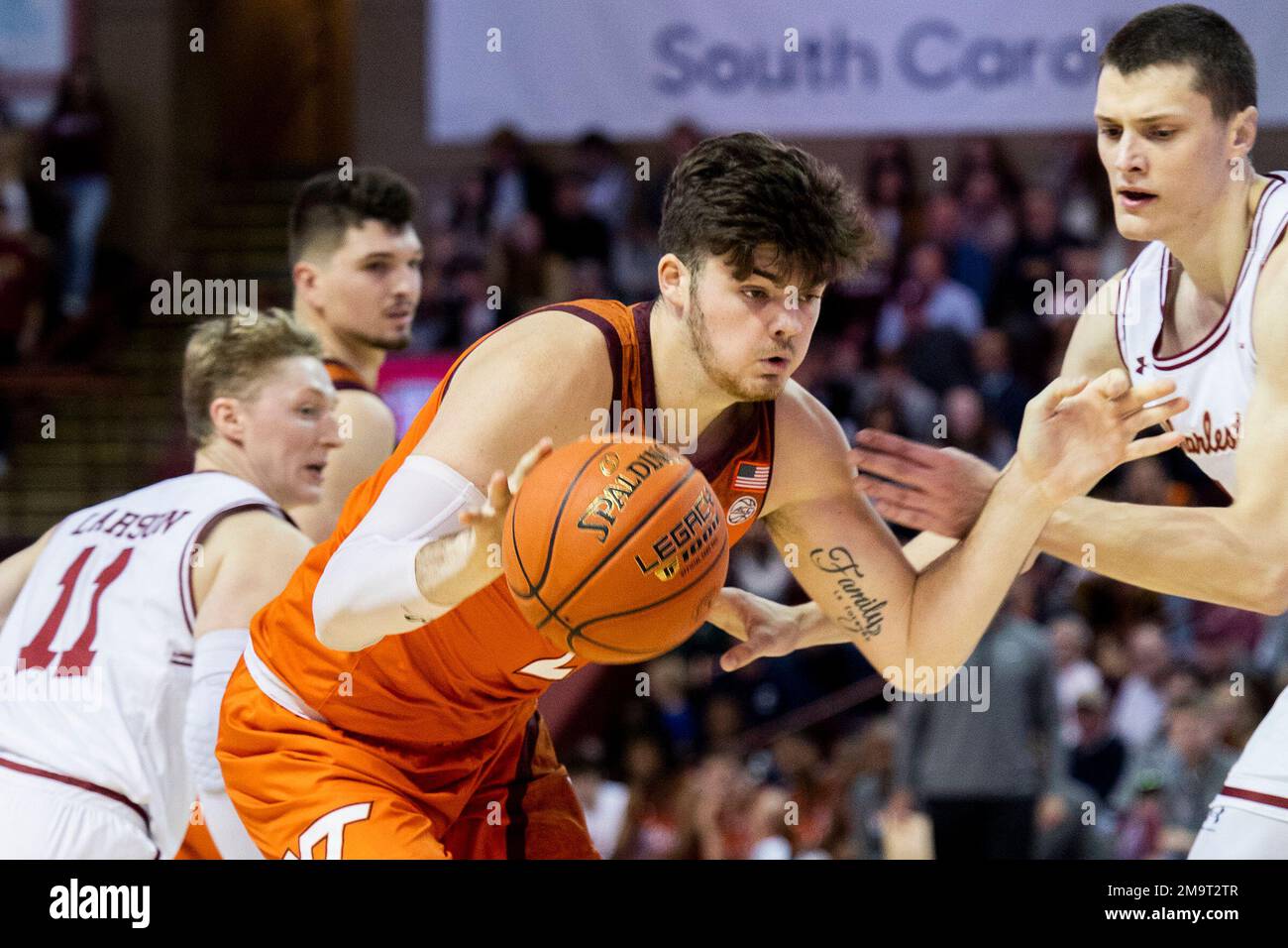 Virginia Tech's Grant Basile (21) drives the basketball against the ...