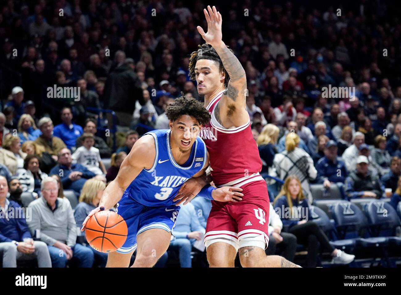 Xavier guard Colby Jones (3) drives to the basket as Indiana guard ...