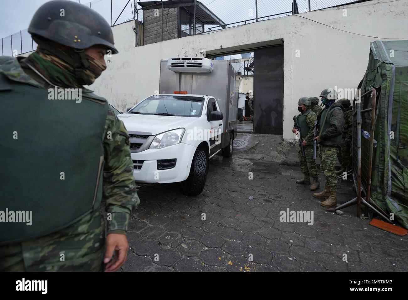 Soldiers guard an entrance to the Inca jail as a forensic crime scene ...