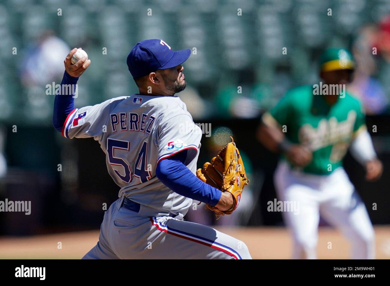 FILE - Texas Rangers' Martín Perez pitches against the Oakland ...