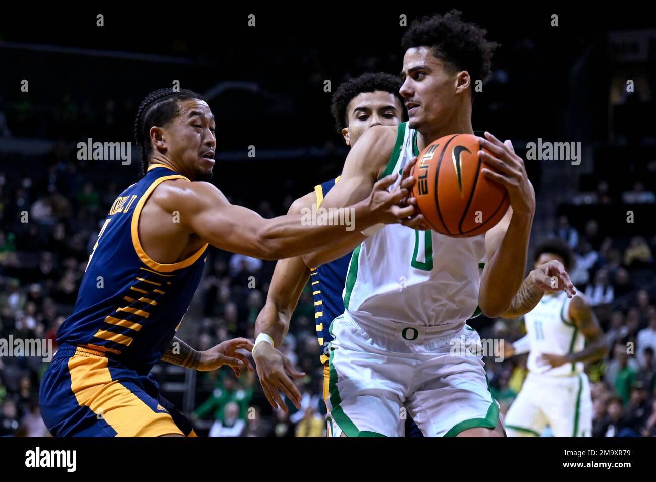 UC Irvine guard Pierre Crockrell, left, and guard Justin Hohn (2) apply ...