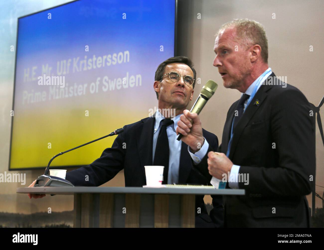 Prime Minister of Sweden Ulf Kristersson, left, listens as Sweden's Chief Climate Negotiator ...
