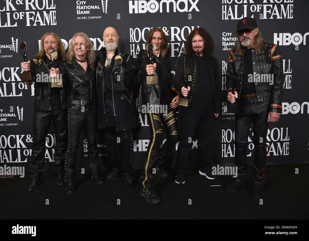 Inductees Ian Hill, from left, K. K. Downing, Rob Halford, Scott Travis ...