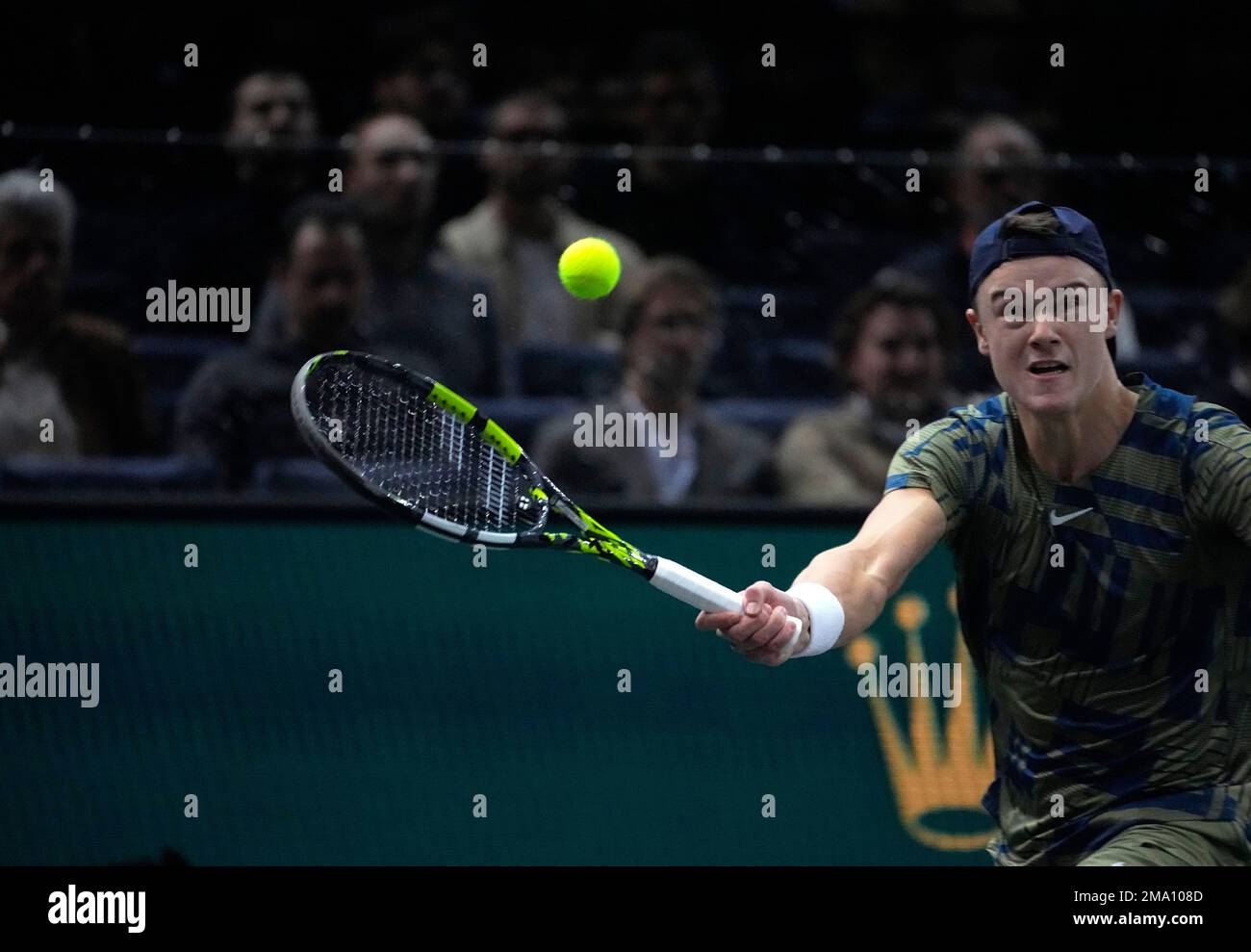 Holger Rune from Denmark returns the ball to Felix Auger-Aliassime of Canada during their semi ...