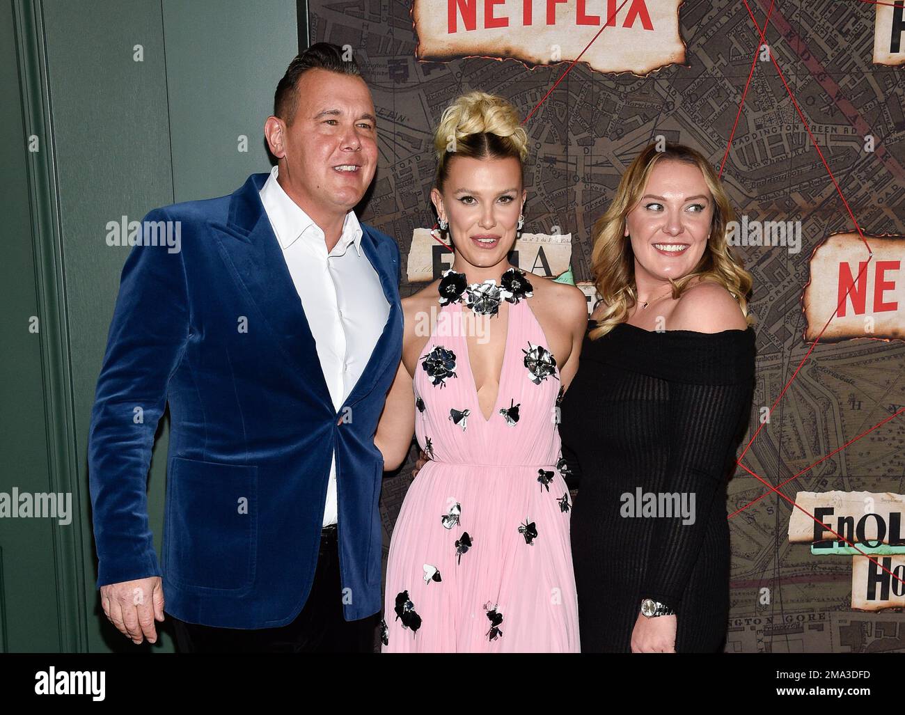 Millie Bobby Brown, center, poses with her father Robert Brown, left ...