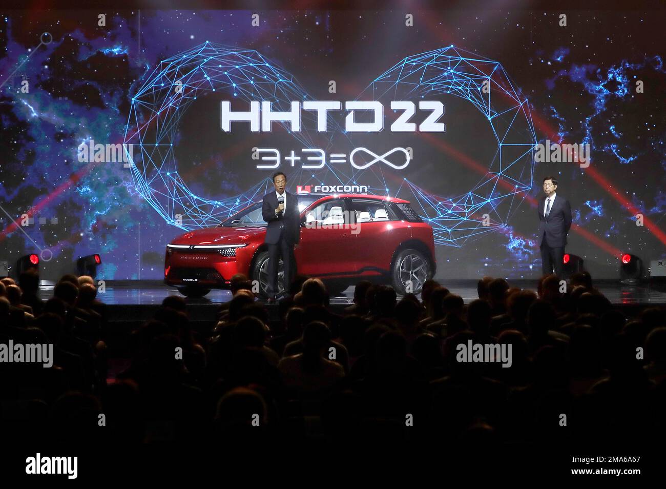 Foxconn founder Terry Gou, left, delivers a speech in front of the ...