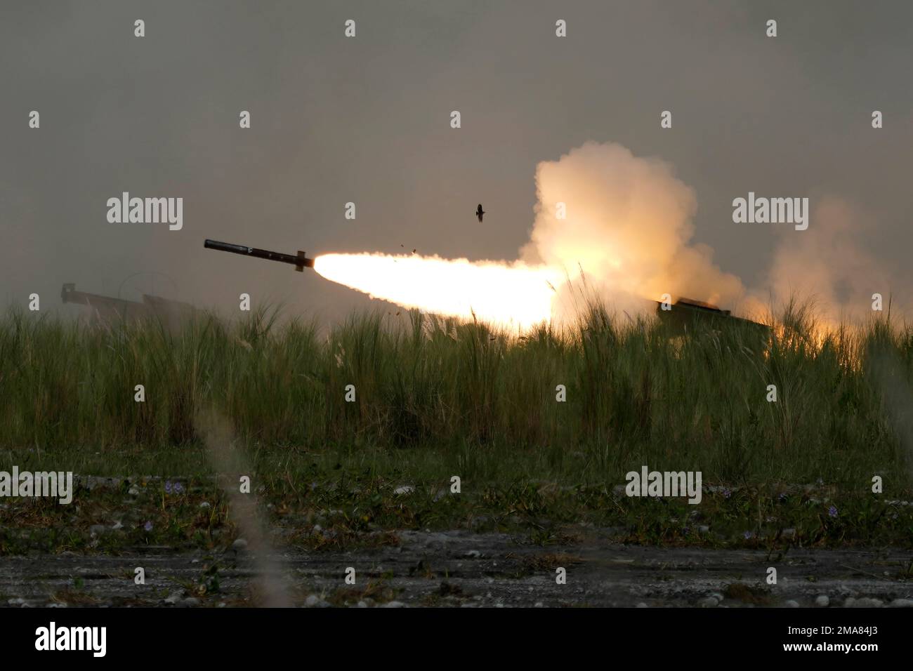 A U.S. M142 High Mobility Artillery Rocket System (HIMARS) fires a ...