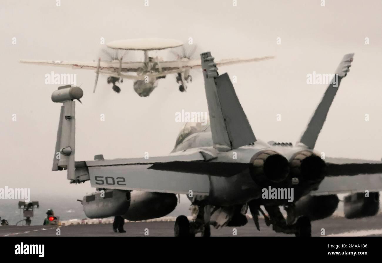 A US Navy E-2 Hawkeye Airborne Command and Control aircraft is launched ...