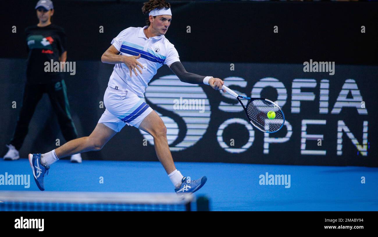 Switzerland's Marc-Andrea Huesler returns a shot during his match against Holger Rune from ...