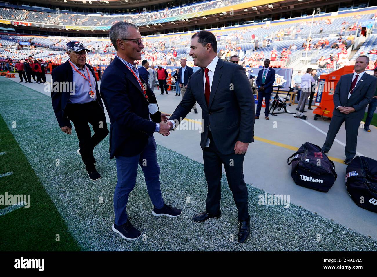 Denver Broncos owner and chief executive officer Greg Penner, left ...