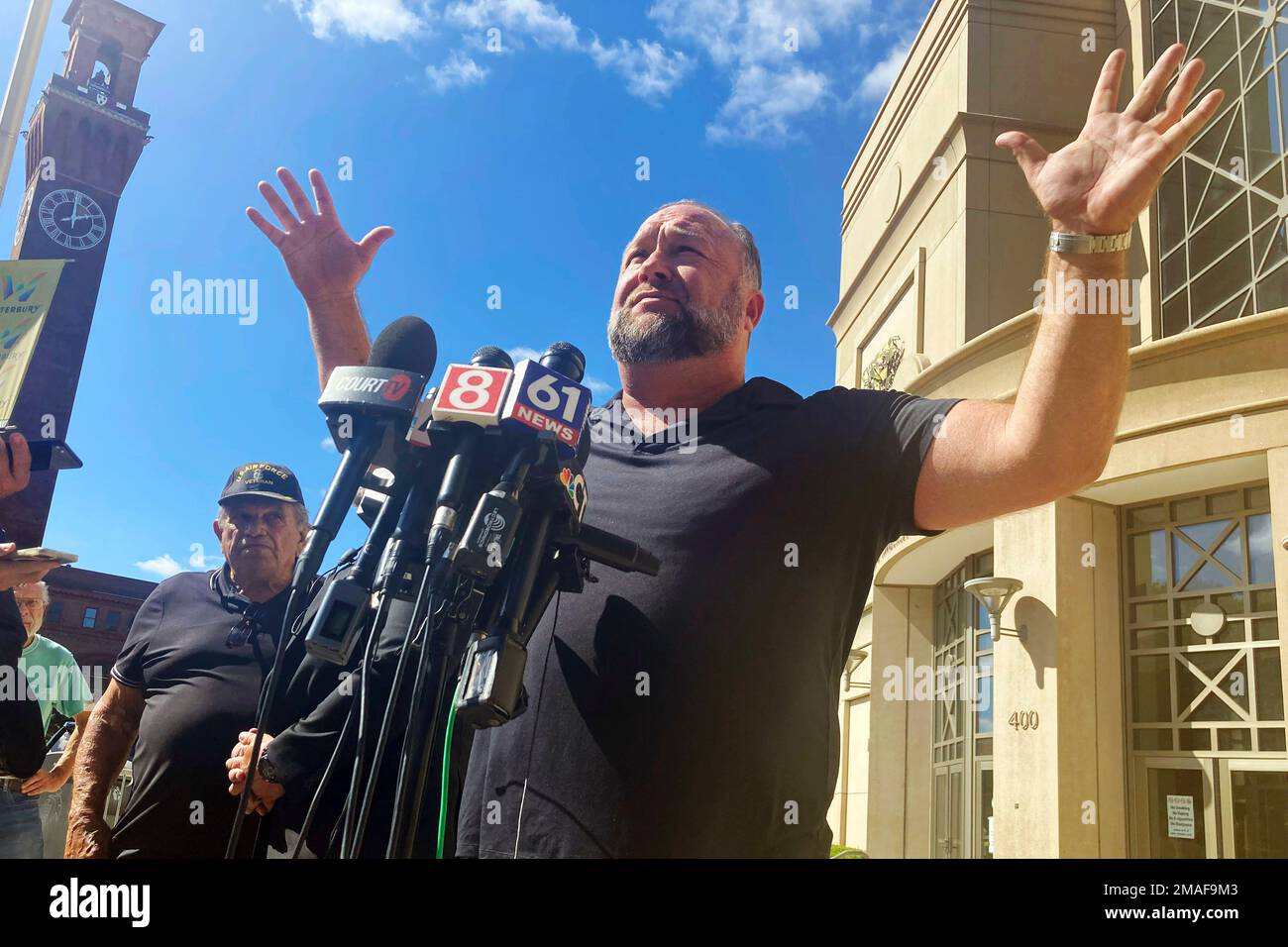 Alex Jones speaks to the media outside the courthouse, in Waterbury ...