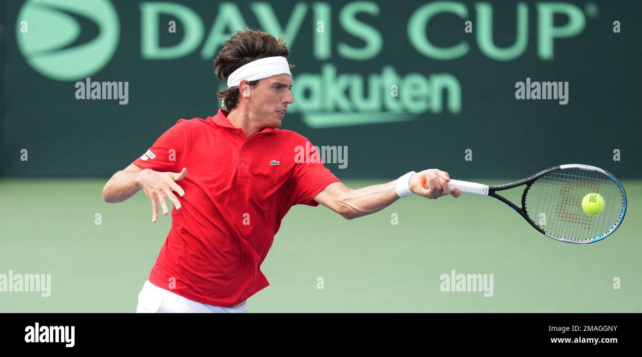 Switzerland's Marc Andrea Husler returns a ball to Ecuador's Emilio ...