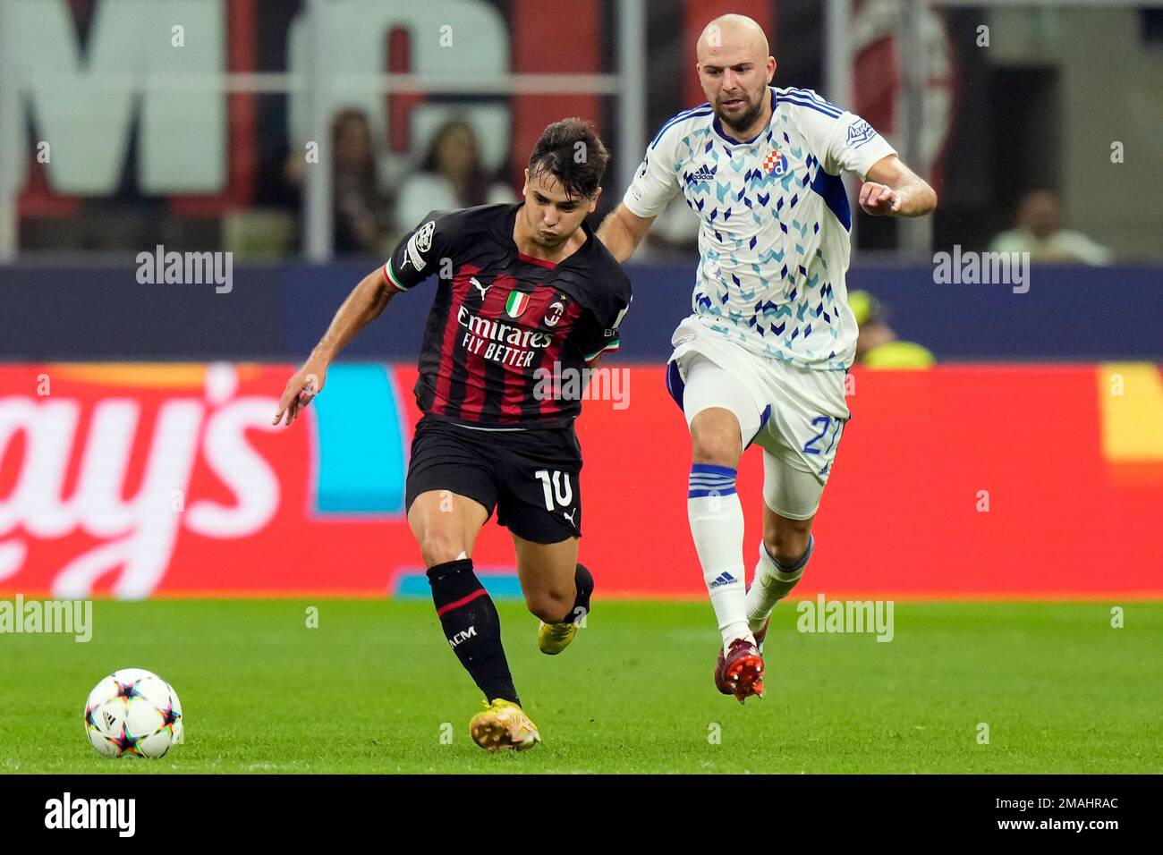 AC Milan's Brahim Diaz, left, challenges for the ball with Dinamo's ...