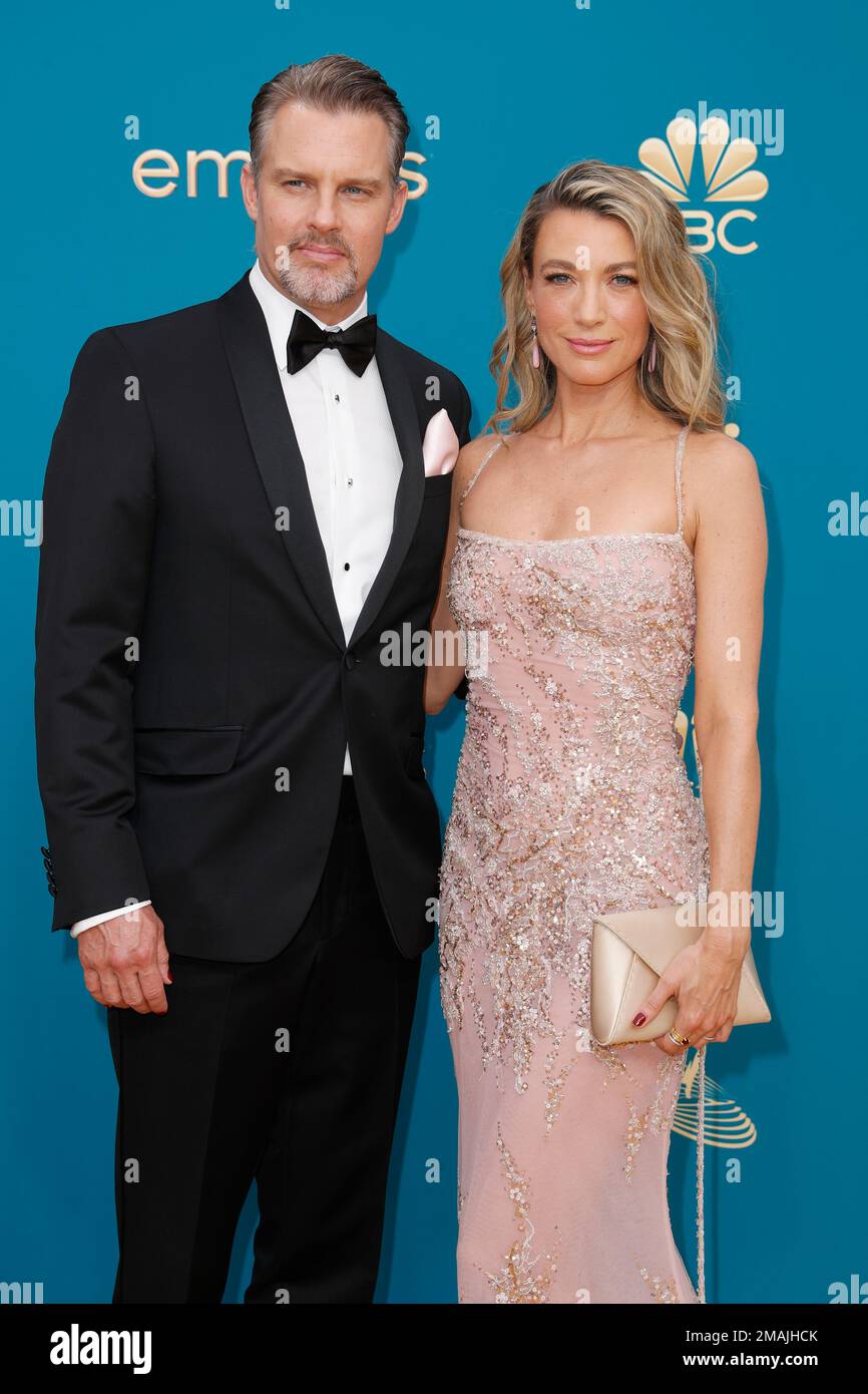 Travis Schuldt, left, and Natalie Zea arrive at the 74th Emmy Awards on ...
