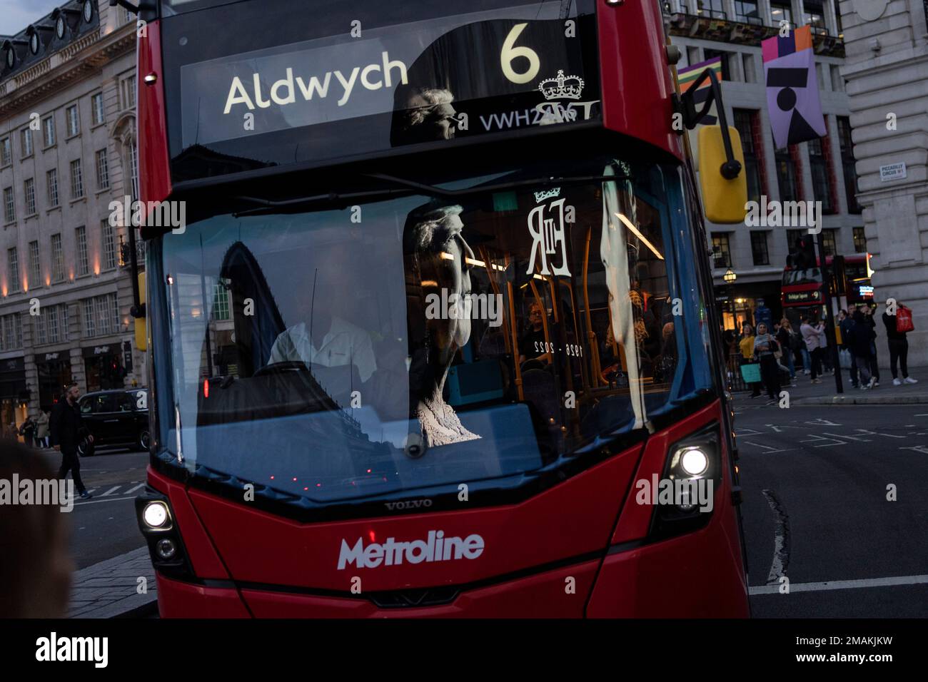 A tribute to the Queen is reflected on a bus at Piccadilly Circus in ...
