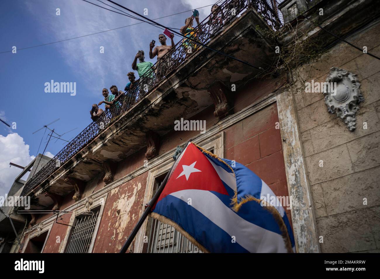 Faithful watch the procession honoring the Virgen de la Caridad del ...