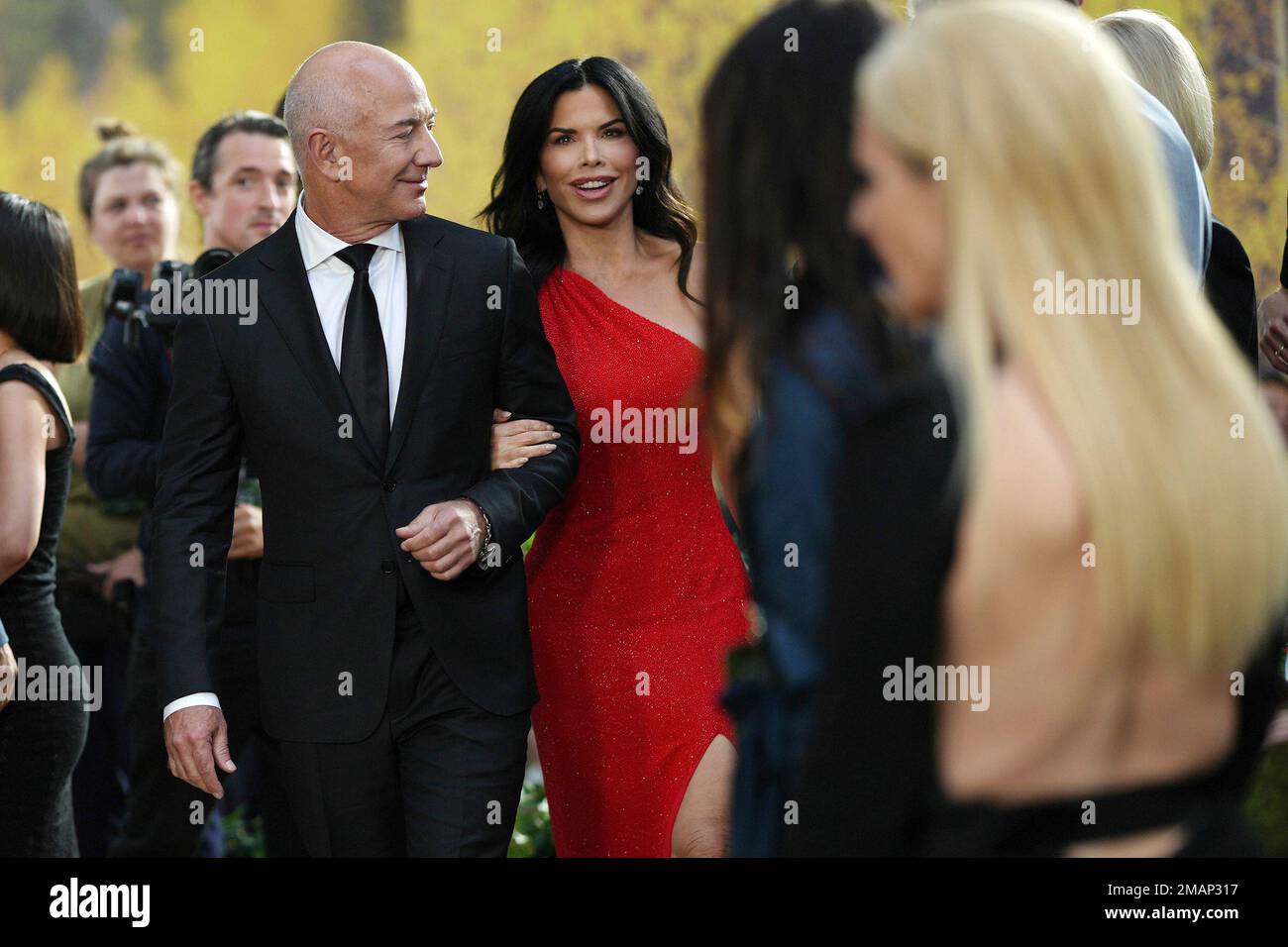 Jeff Bezos, left, and Lauren Sanchez pose for photographers upon their ...