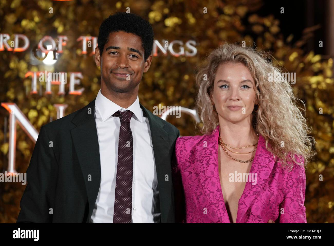 Alfred Enoch, left, and Mona Godfrey pose for photographers upon ...