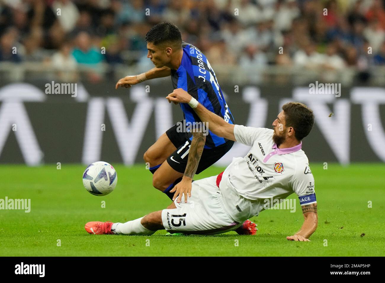 Inter Milan's Joaquin Correa, left, is fouled by Cremonese's Matteo ...