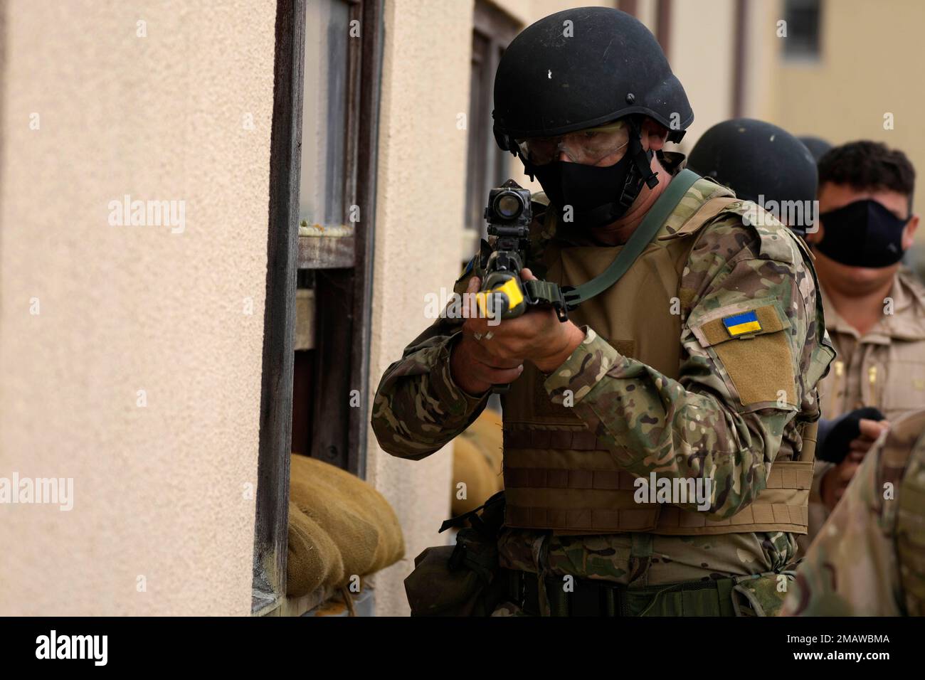 Ukrainian volunteer military recruits take part in an urban battle exercise whilst being trained ...