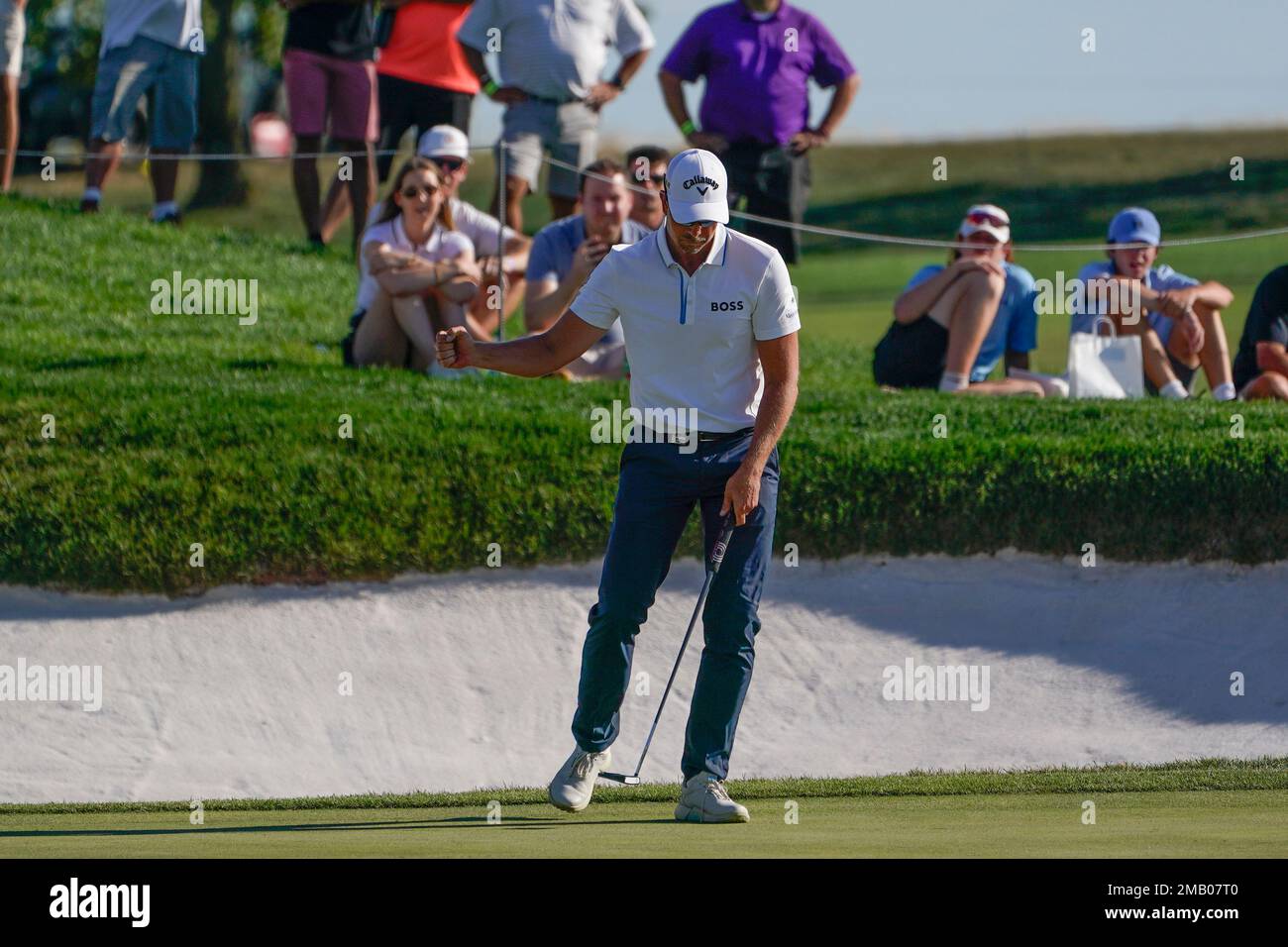 Henrik Stenson reacts after sinking a putt on the 16th hole during the ...