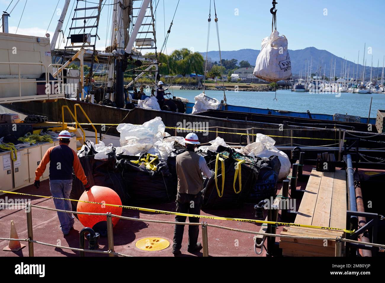 Plastics and other debris from the North Pacific Gyre are unloaded from ...