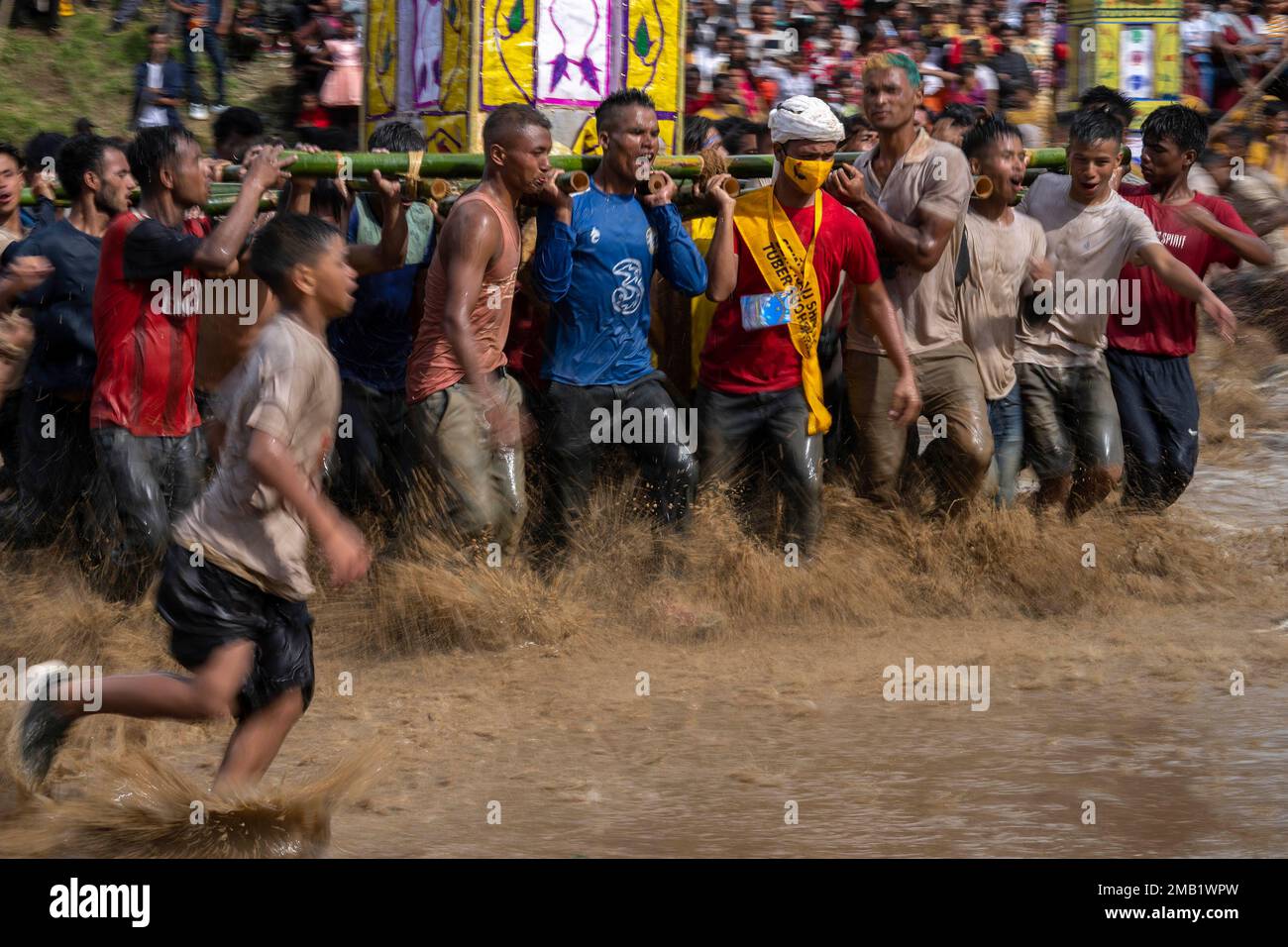 Pnar, or Jaintia, tribals carry 'Rongs' or chariots and dance in muddy ...